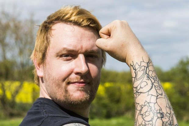 Watch - Simpsons superfan has Homer tattooed on his arm 52 Times