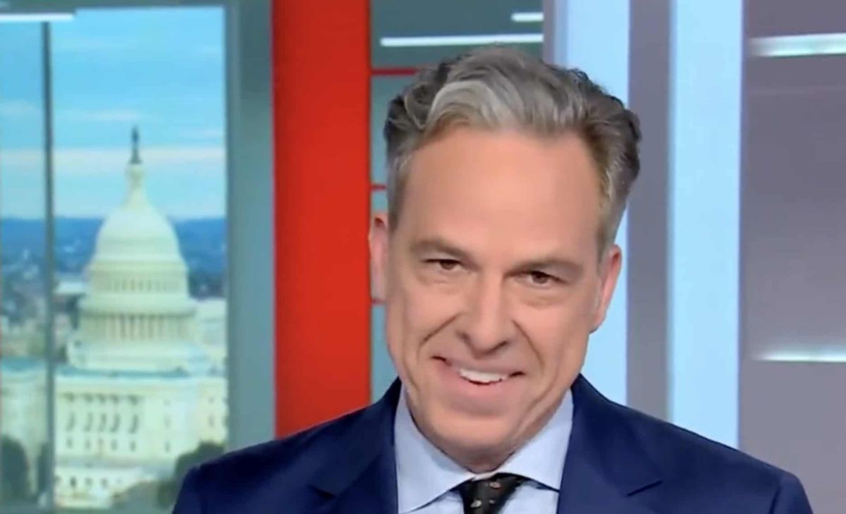 CNN host bursts out laughing while reporting on Fox News' legal woes